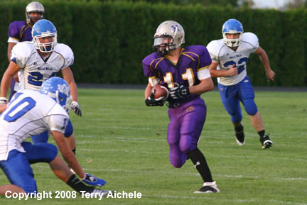 LEFT - Anthony Montez of Hermiston carries the ball after catching a ...