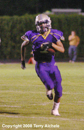 LEFT - Luis Ortiz, Hermiston wide receiver, running into WaHi territory ...