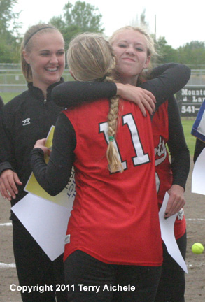 LEFT - Claire Ely of Weston-McEwen hugs a teammate.[img_5268]RIGHT ...