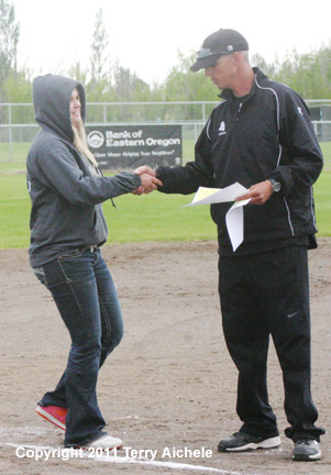 LEFT - Claire Ely of Weston-McEwen hugs a teammate.[img_5268]RIGHT ...
