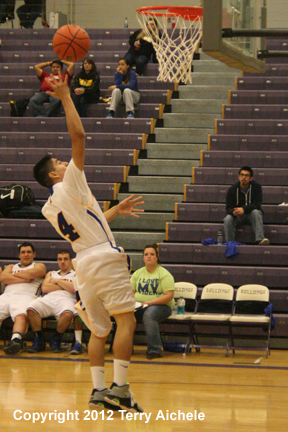 Filipe Rodriguez of Stanfield drives to the basket for a lay up.[img_6555]