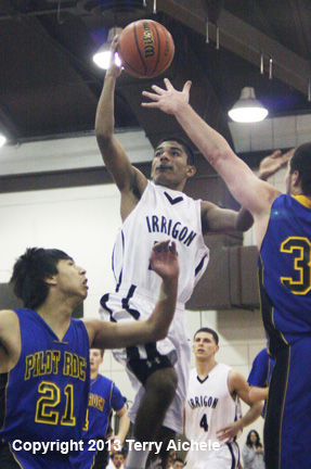 Irrigon's Fredy Vera threads his way to the basket between Pilot Rock ...