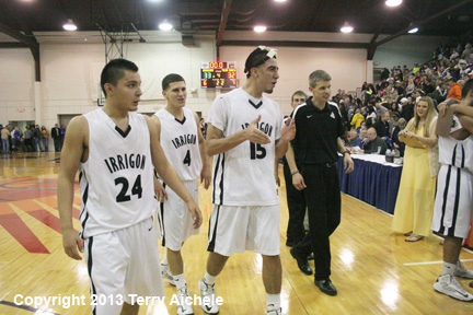 LEFT - Jose Romero of Irrigon takes a shot over a Pilot Rock defender ...