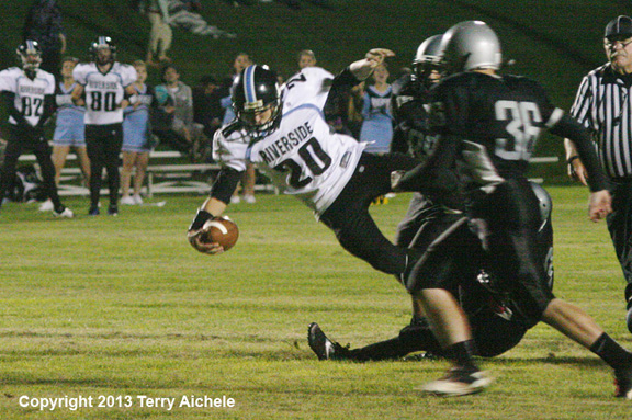 LEFT - Irrigon defenders swarm towards Riverside running back Gavin ...