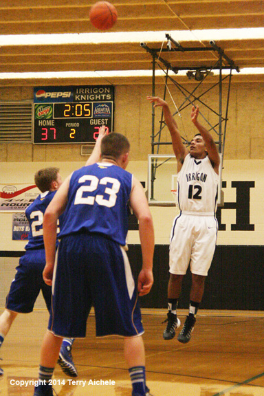 LEFT - Fredy Vera of Irrigon shoots a trey late in the second period ...