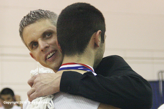 LEFT - Irrigon head coach Jake McElligott hugs Adrian Romero following ...