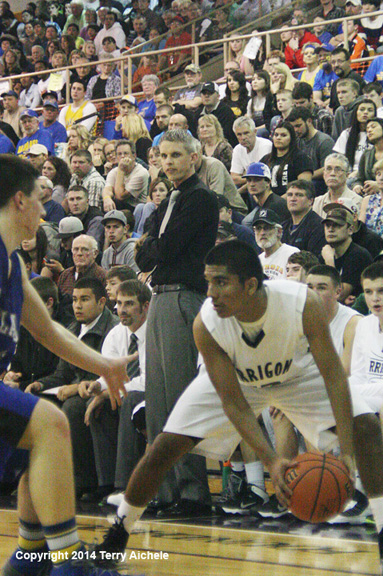 LEFT - Ernesto Aguilera of Irrigon, in white, looks for an opening.[img ...