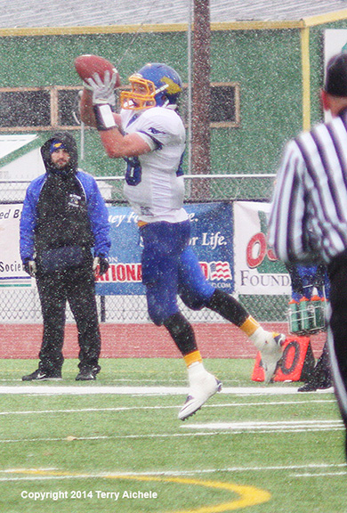 LEFT - Jesse Corbin of Heppner, number 3 in white, breaks up a pass to ...